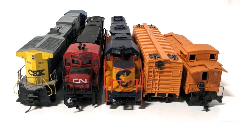 HO Scale Model Trains: 3 Locomotive Engines, 1 Train Car & 1 Caboose.